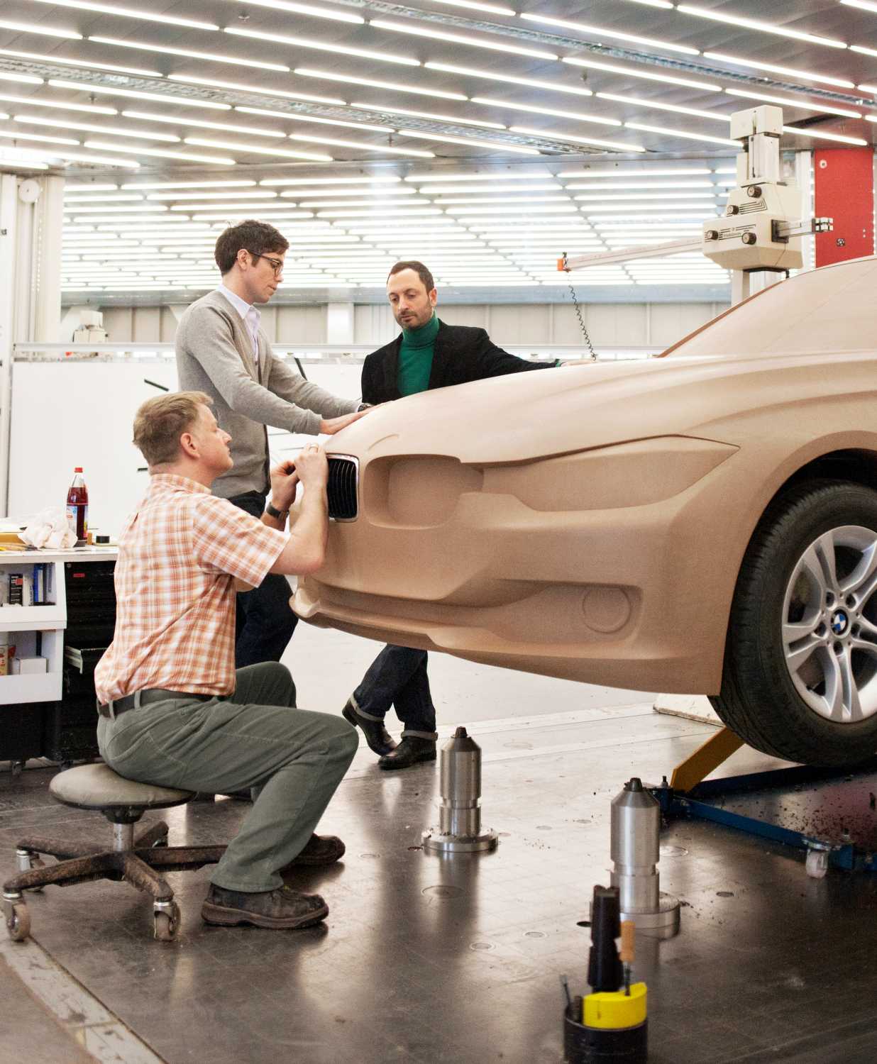 Designer team working on a clay-model of the new BMW 3 Series. (09/2012)